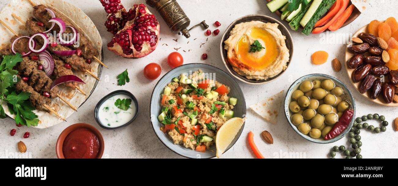 Arabic and Middle Eastern food, dinner table. Meat kebab, hummus ...