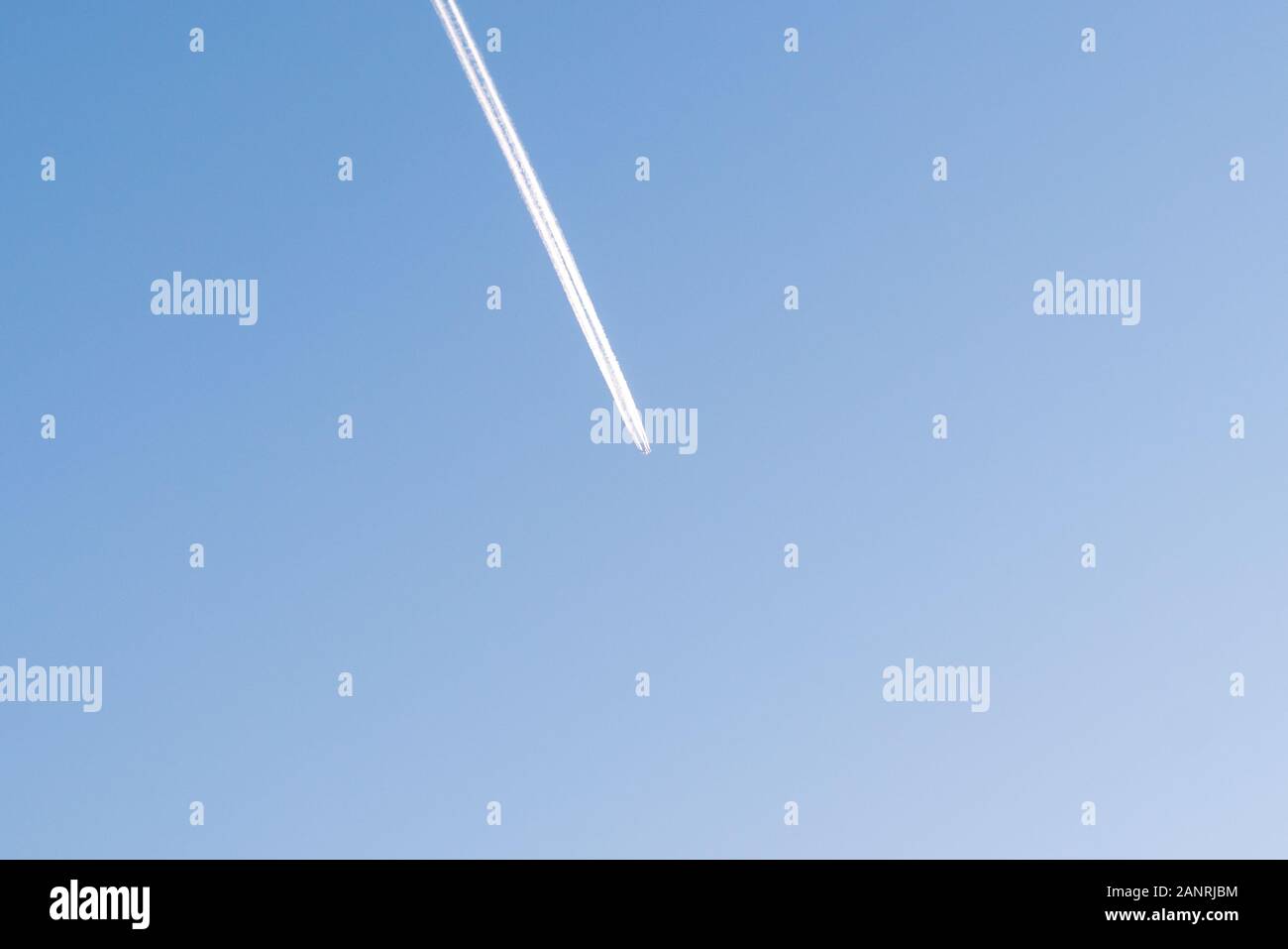 Plane High in the Sky Stock Photo - Alamy