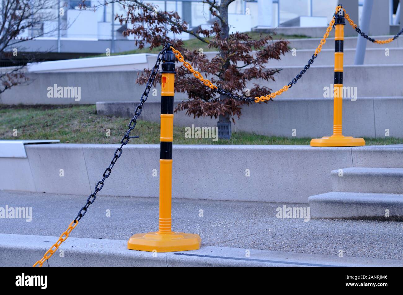 plastic chain as safety barrier at concrete steps at outdoor staircase ...