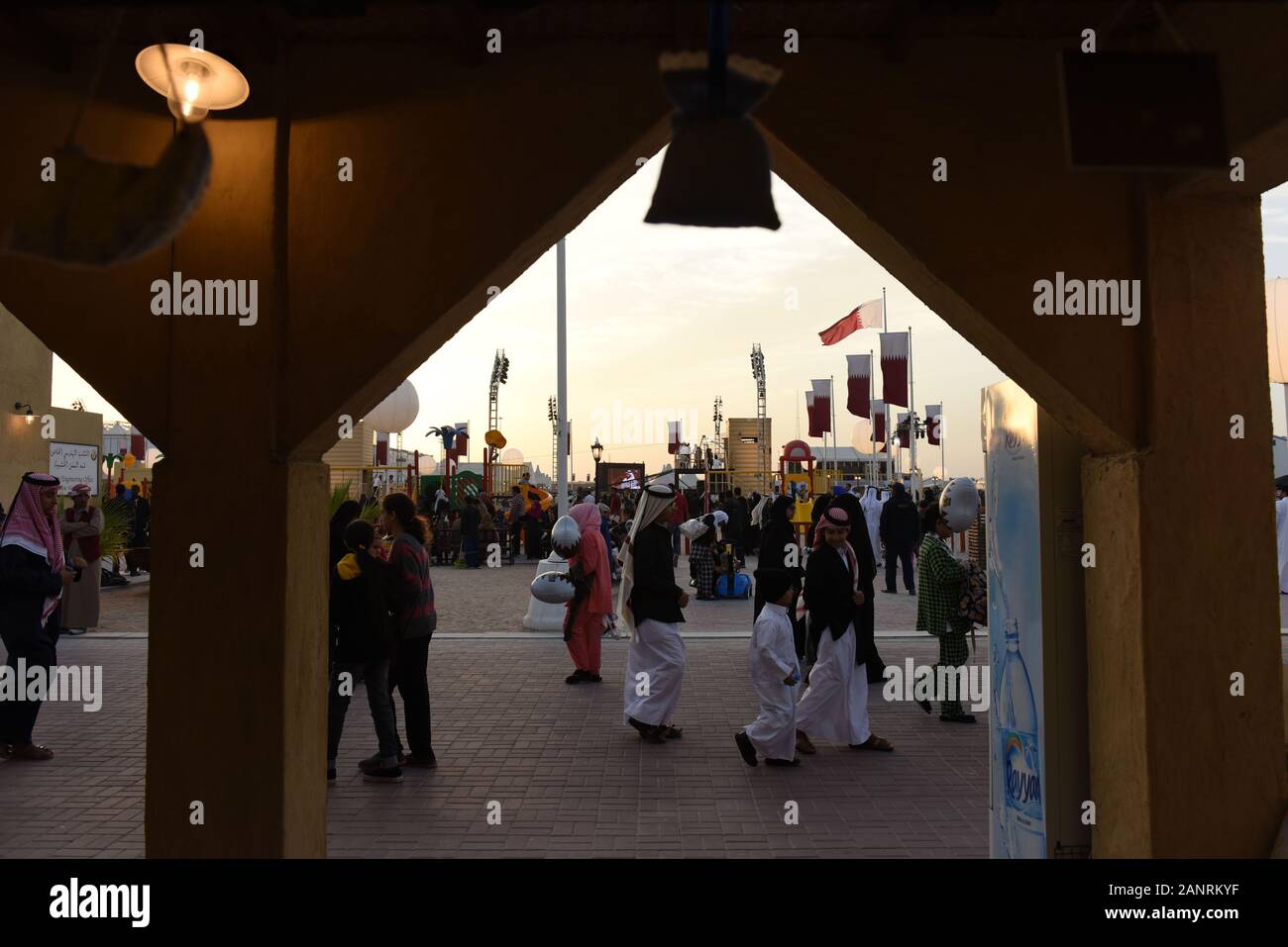 Group of qatari men walking at Darb Al Saai in Qatar National day Stock ...