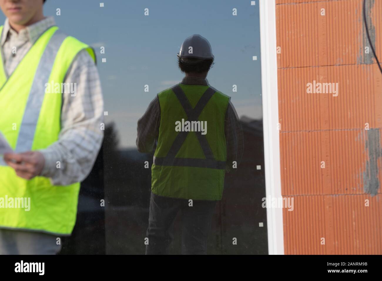 Professional engineer architect worker with protective helmet at house ...