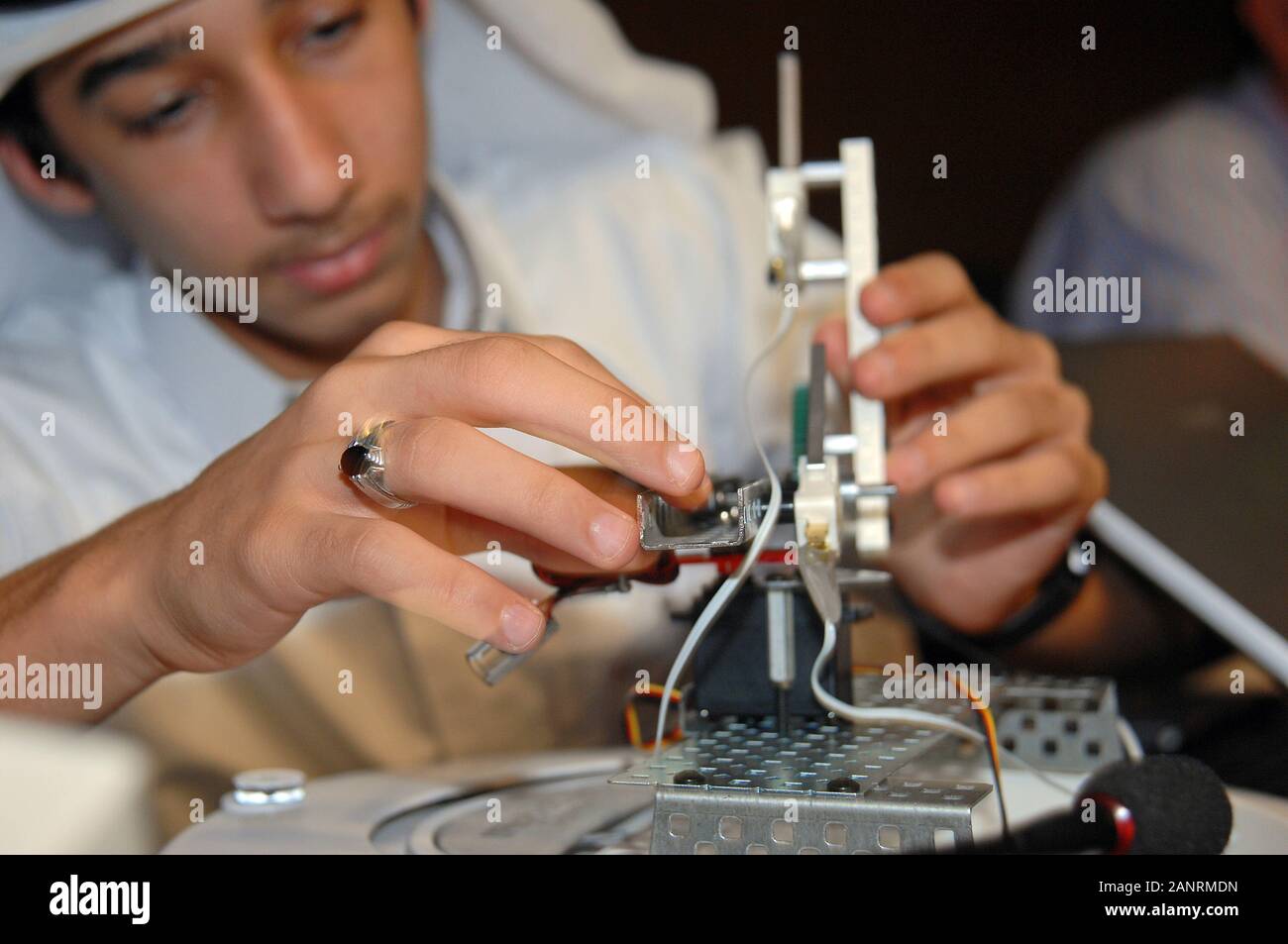 Qatar Foundation University. Qatari Student building a robot for the ...