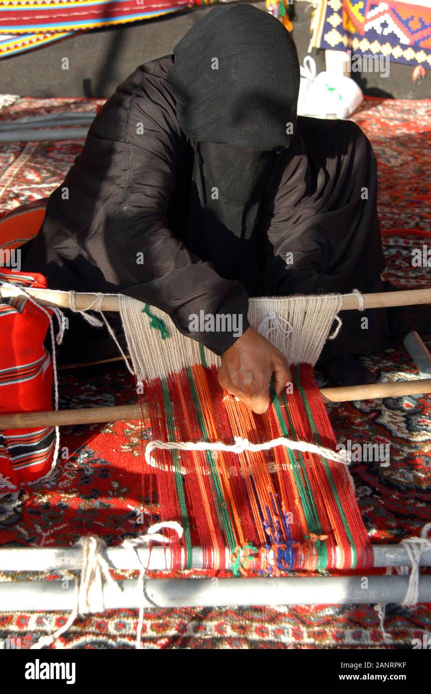 Qatari woman making a carpet Doha, Qatar Stock Photo - Alamy