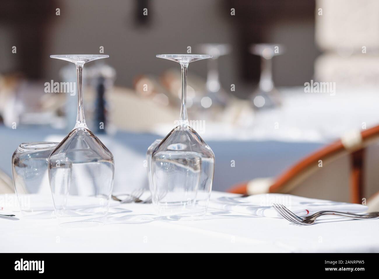 Catering service. Table setting, glass goblets, cutlery Stock Photo - Alamy