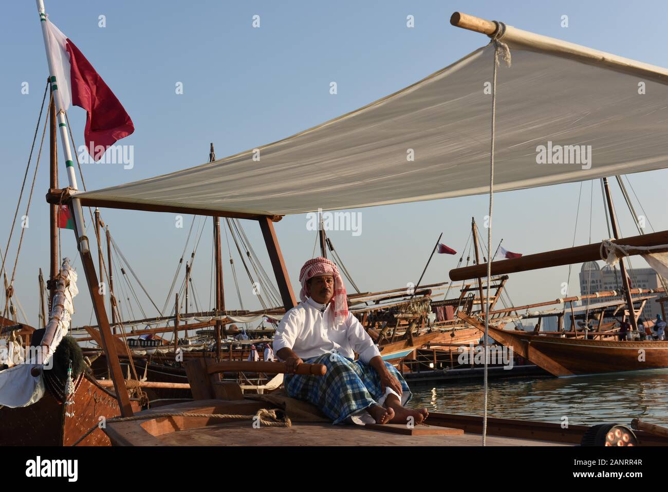 Man sitting on a Dhow, Katara Traditional Dhow Festival, Doha, Qatar ...