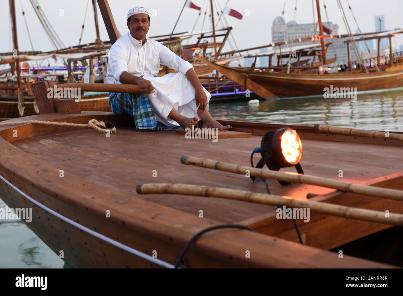 Man sitting on the Dhow, Katara Traditional Dhow Festival, Doha, Qatar ...