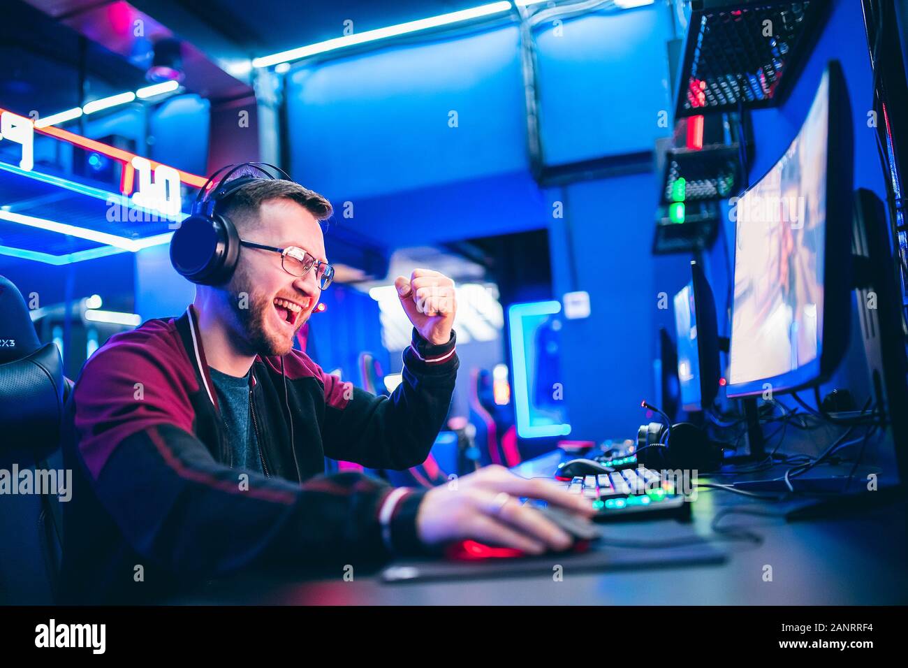 Professional gamer playing tournaments online video games computer with ...