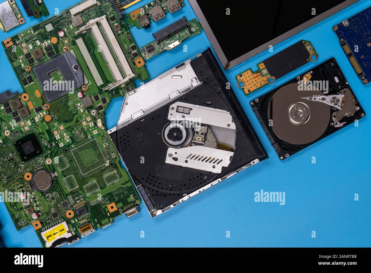 Parts of a modern computer. The insides of a laptop on a blue ...