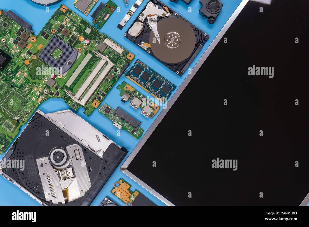 Parts of a modern computer. The insides of a laptop on a blue ...