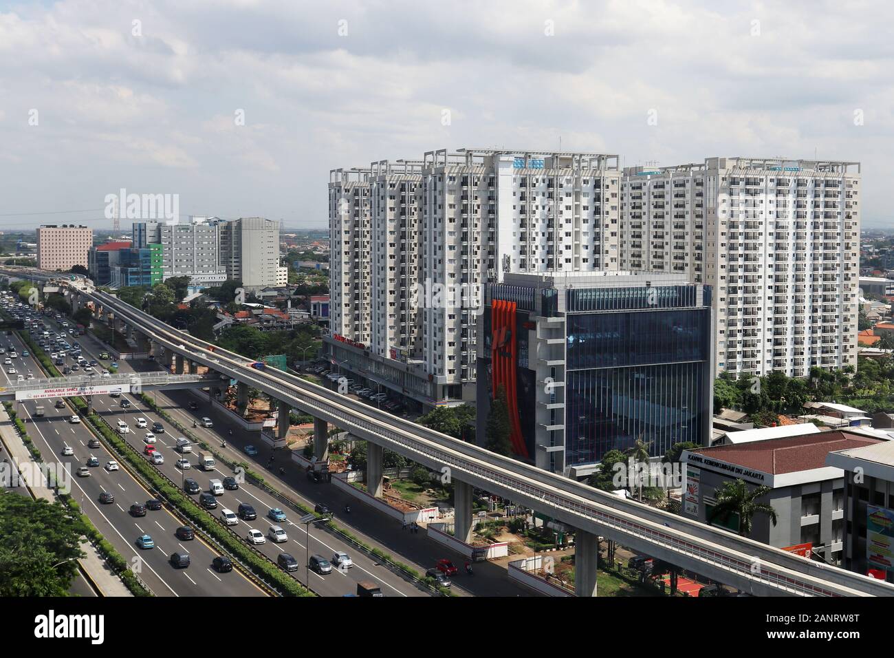 aerial Jakarta cityscape with LRT fly over railroad at MT Haryono ...