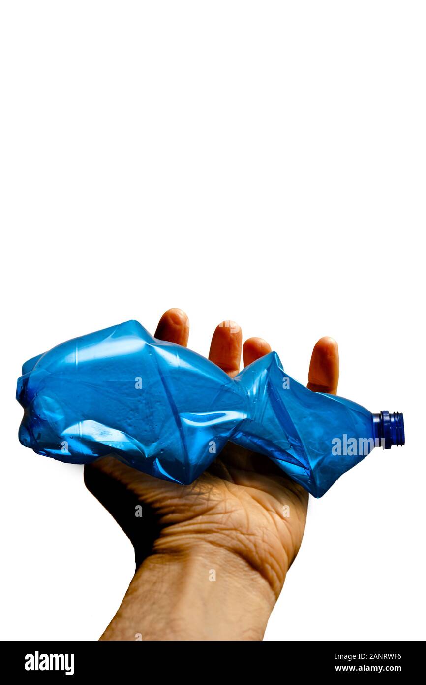 male hand holding a blue plastic bottle as concept for recycling Stock ...