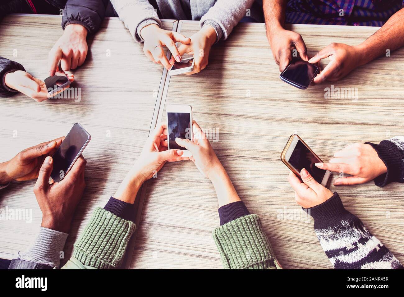 Group of hands holding cell phones hi-res stock photography and images ...