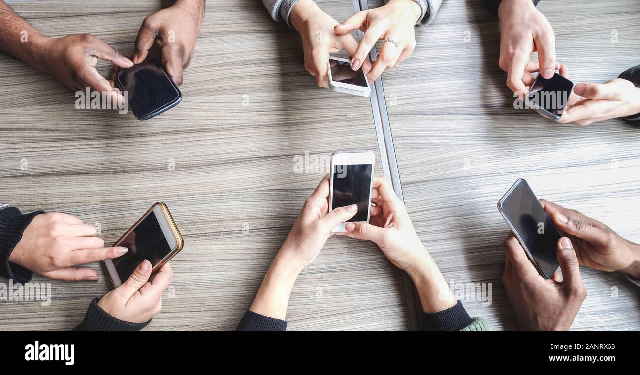 Group of friends using smartphone - People hands view having fun with ...