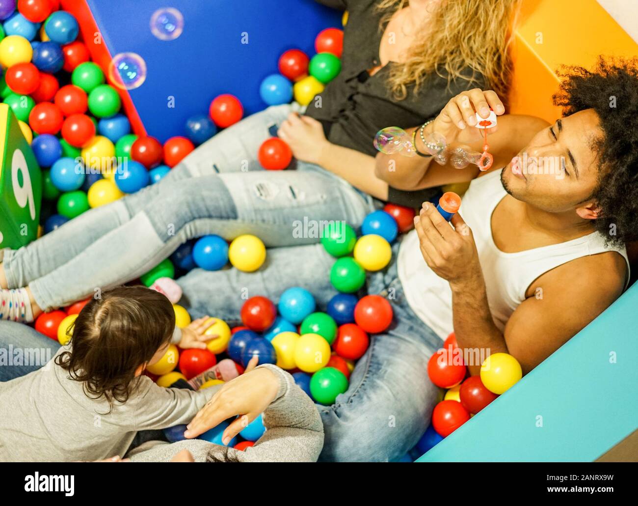 Children playing inside ethnic hi-res stock photography and images - Alamy
