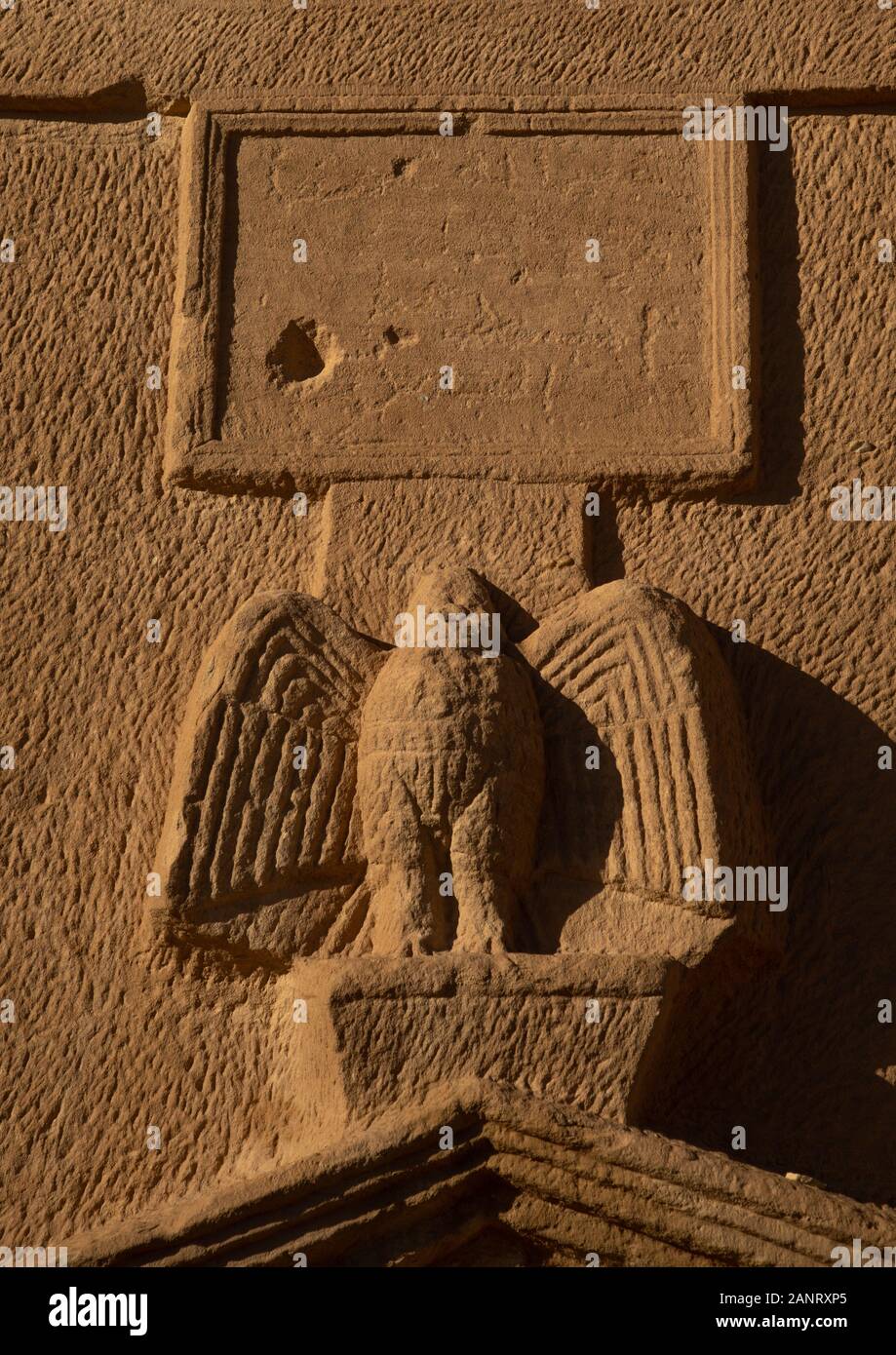 Carved eagle on a tomb in al-Hijr archaeological site in Madain Saleh ...