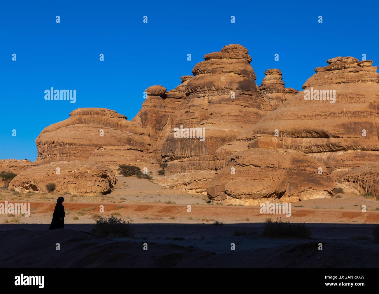 Woman silhouette in the rocky landscape of Madain Saleh, Al Madinah ...