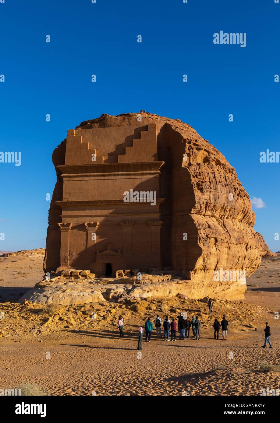 Tourists in front of qasr al-farid tomb of Lihyan son of Kuza in Madain ...