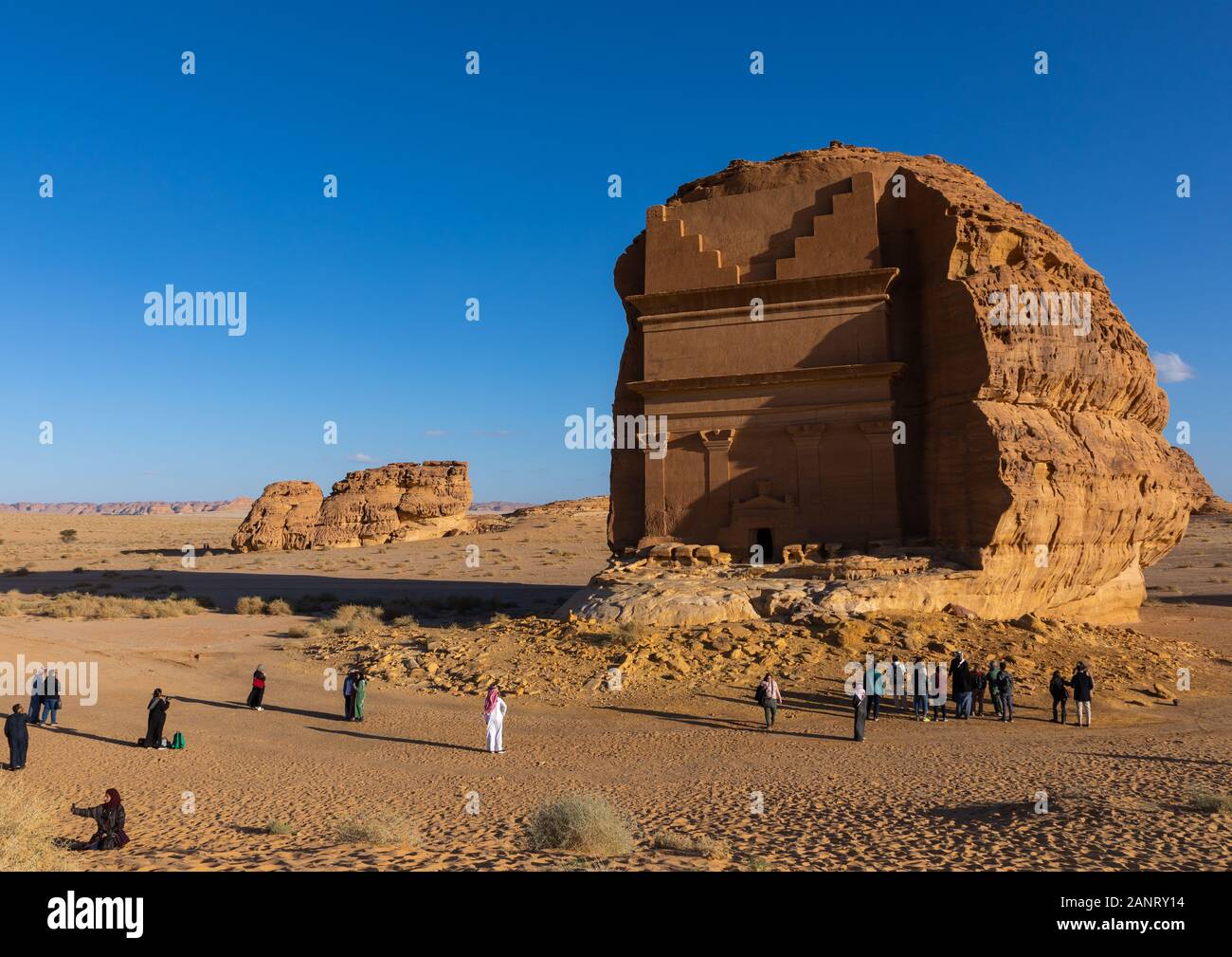 Tourists in front of qasr al-farid tomb of Lihyan son of Kuza in Madain ...