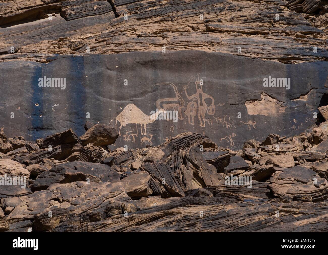 Petroglyphs rock art depicting humans and camel, Najran Province ...