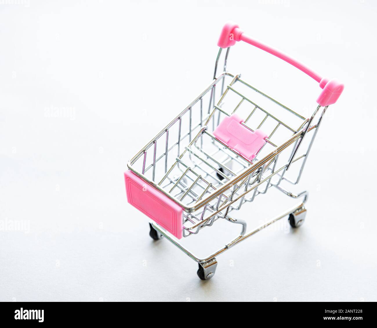 Small supermarket grocery push cart for shopping on white background ...