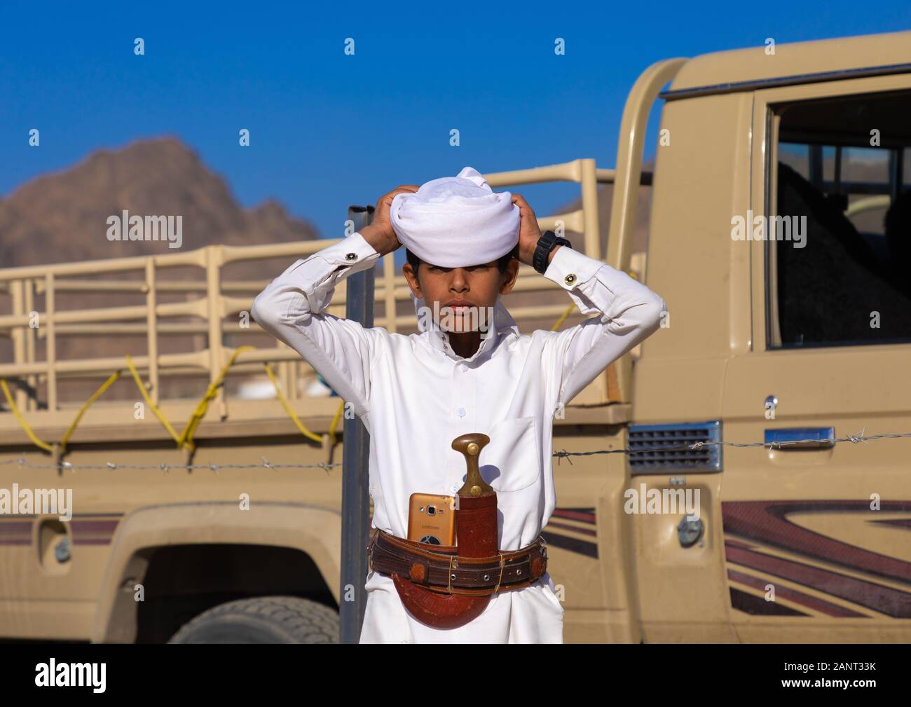 Portrait of a saudi boy wearing a white tradtional clothing, Najran ...