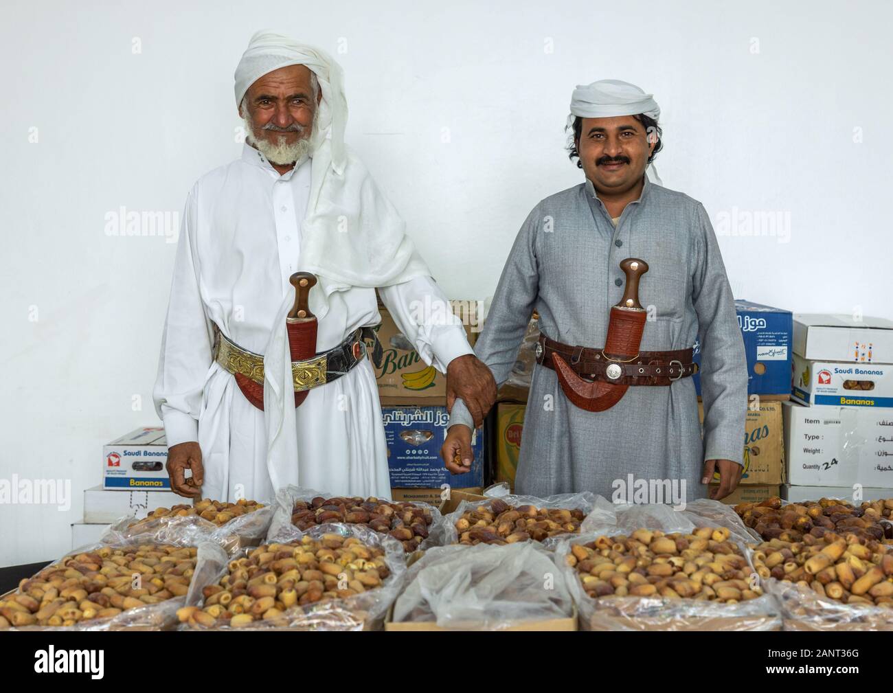 Portrait of saudi men selling dates in a shop, Najran Province, Najran ...