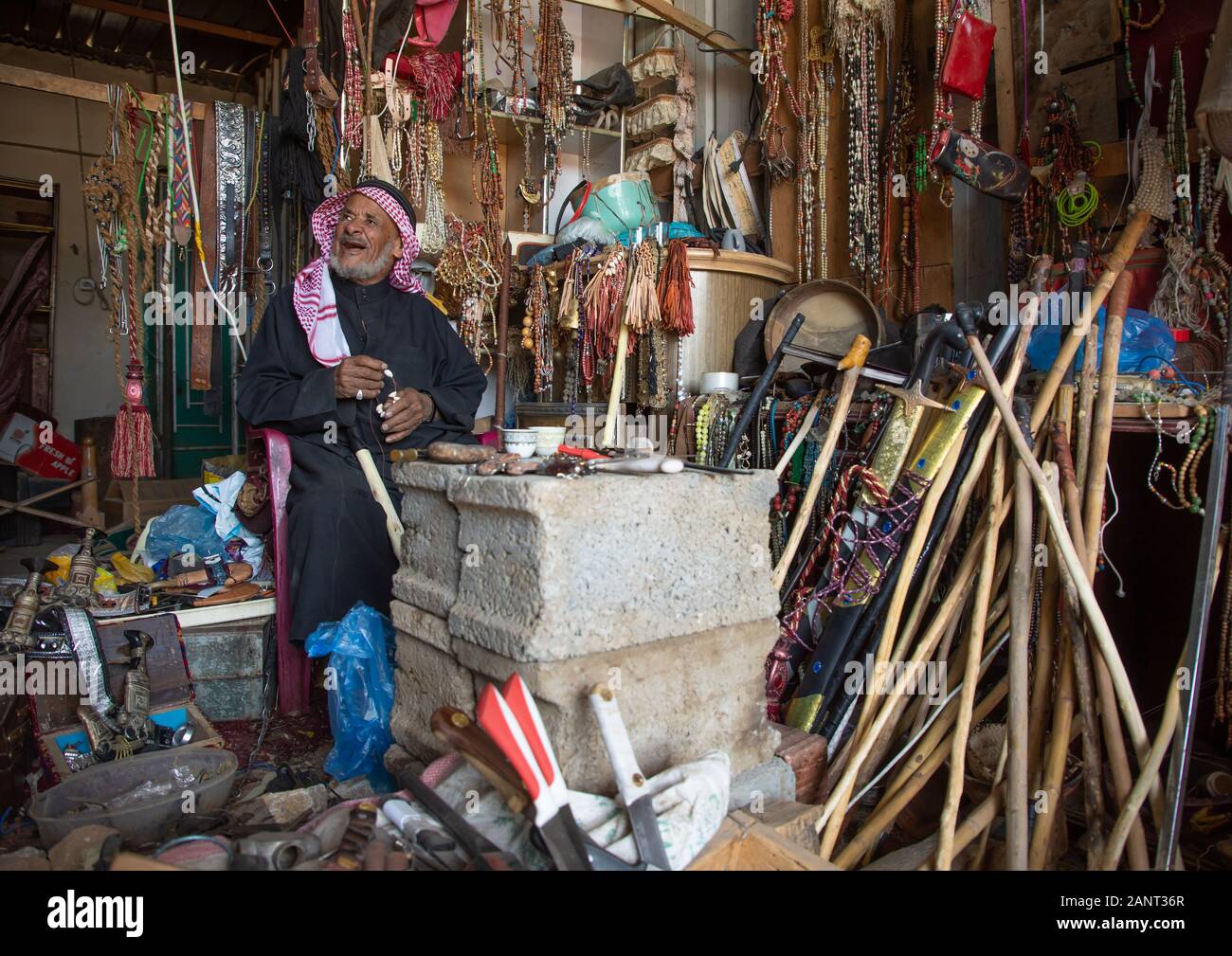 Saudi man selling antique stuff in a shop, Najran Province, Najran ...