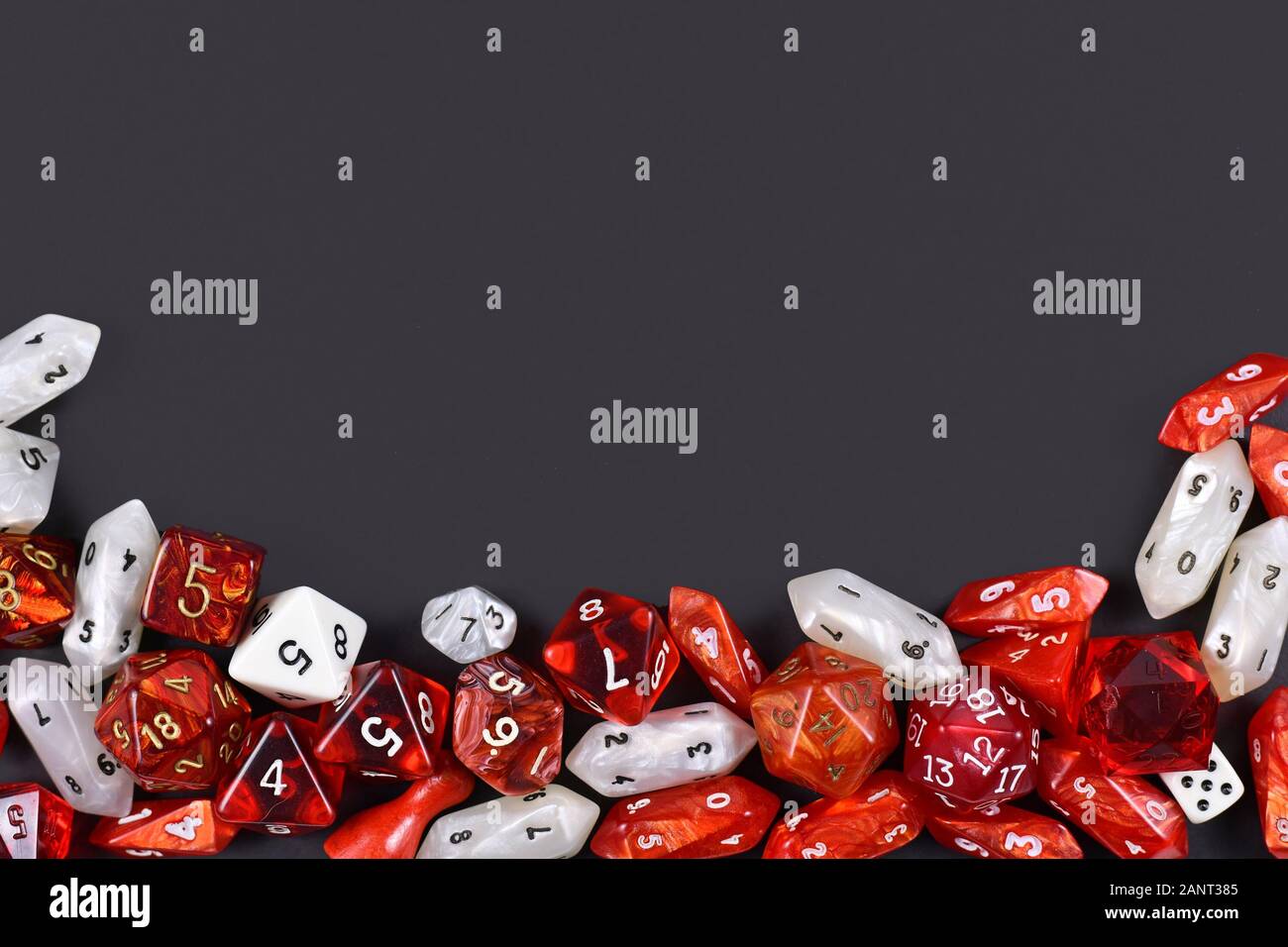 Background with different roleplaying RPG dice at bottom of dark black ...