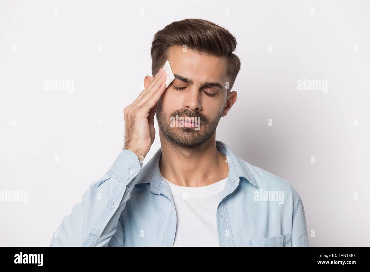 Overheated sweaty young man suffering from high temperature Stock Photo ...