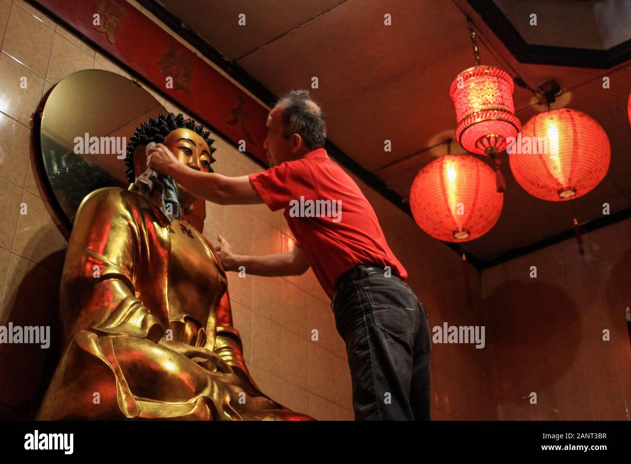 A man cleans a statue during the celebration at Dharma Ramsi temple in ...
