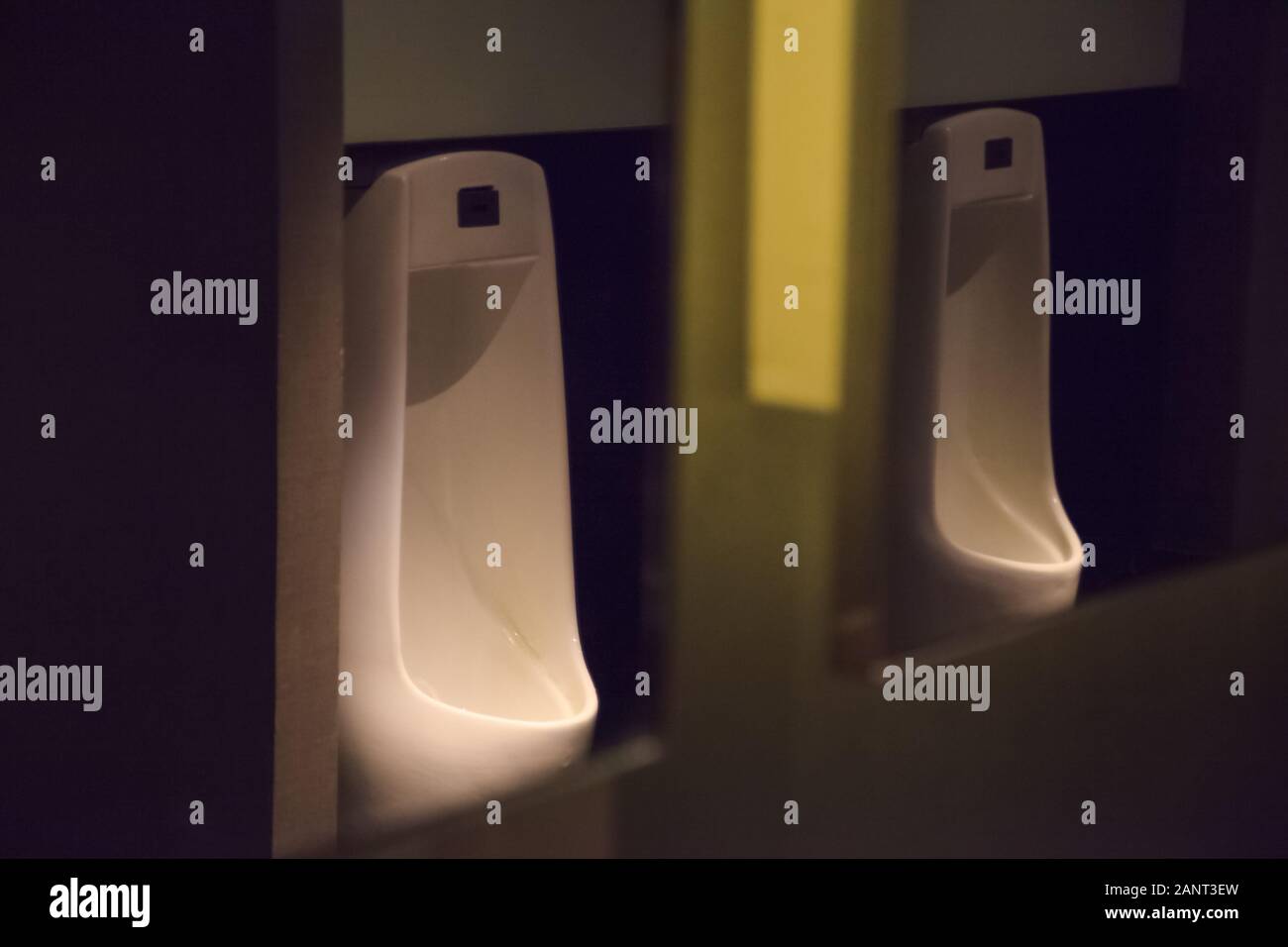 clean white male lavatory urinal sanitary ware vessel fixture or ...