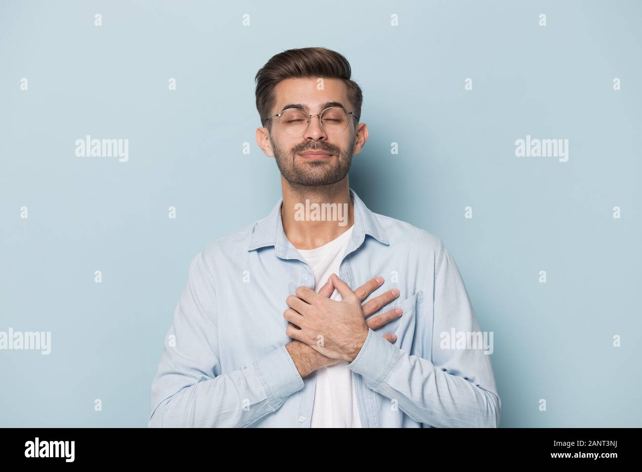 Happy thankful mindful young guy feeling hopeful Stock Photo - Alamy