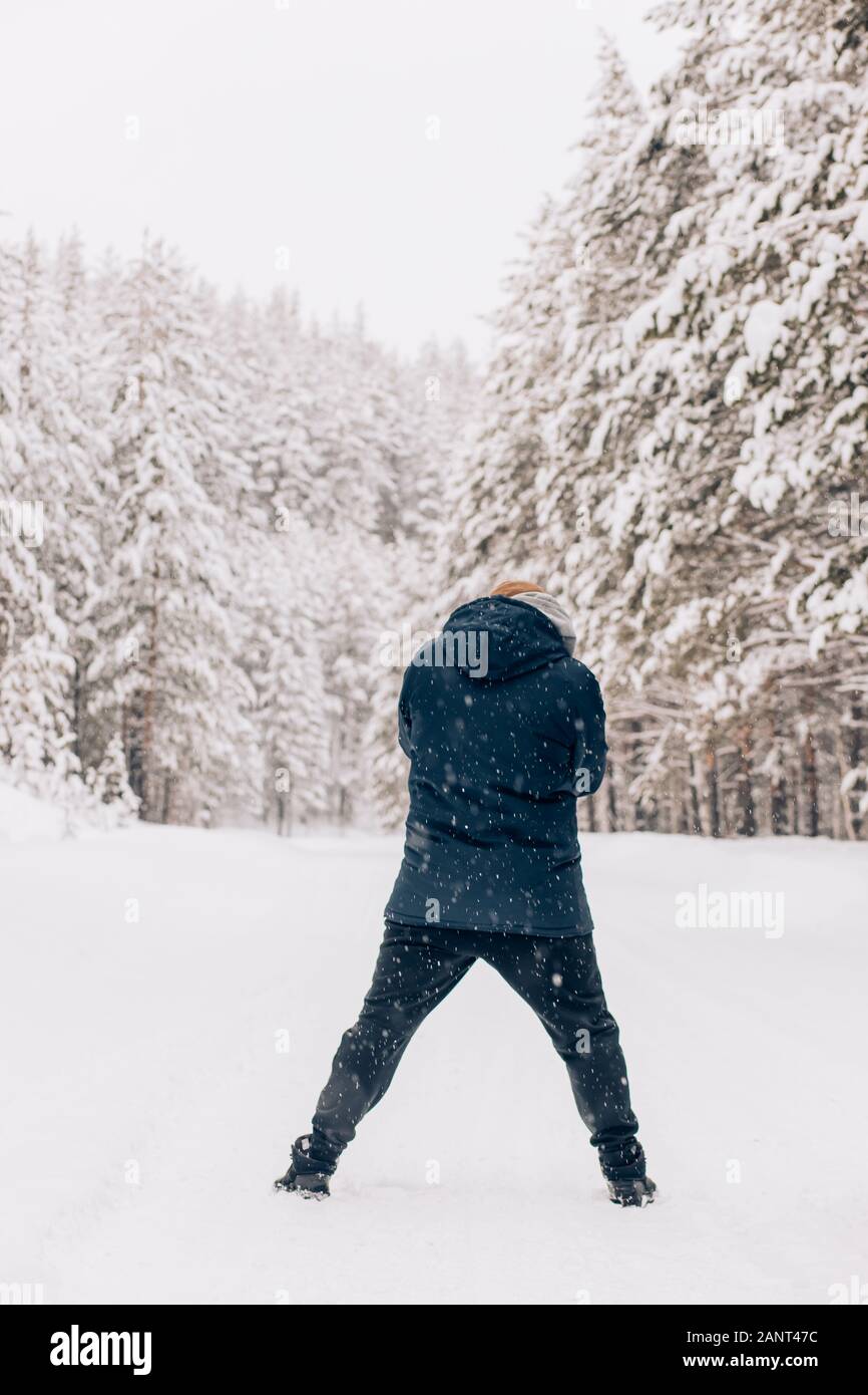 Outdoor from behind portrait of handsome man in coat. Workflow of a ...