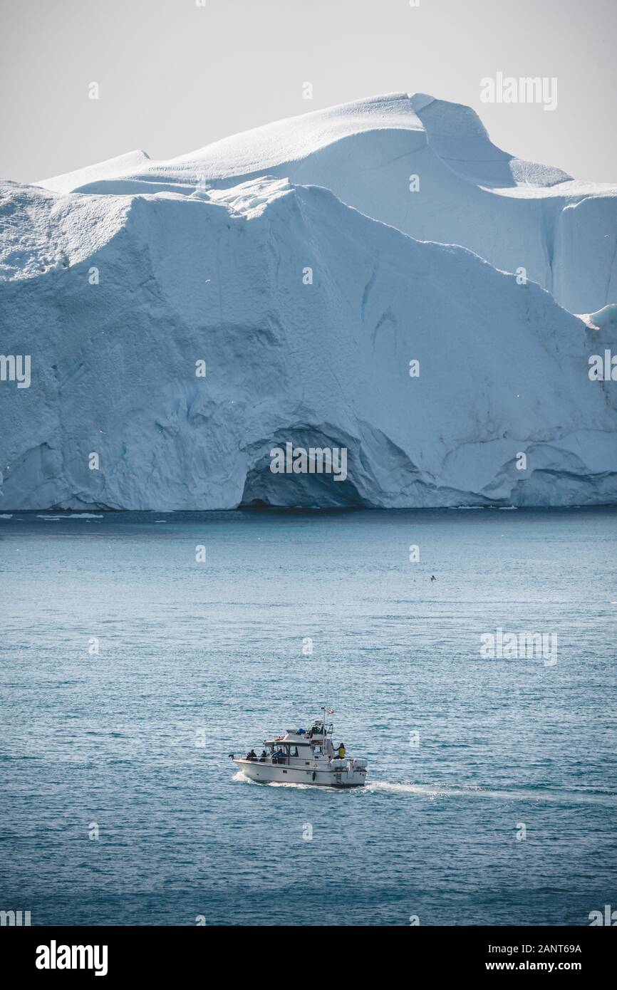 Passenger cruise ship sailing through the icy waters of arctic ...