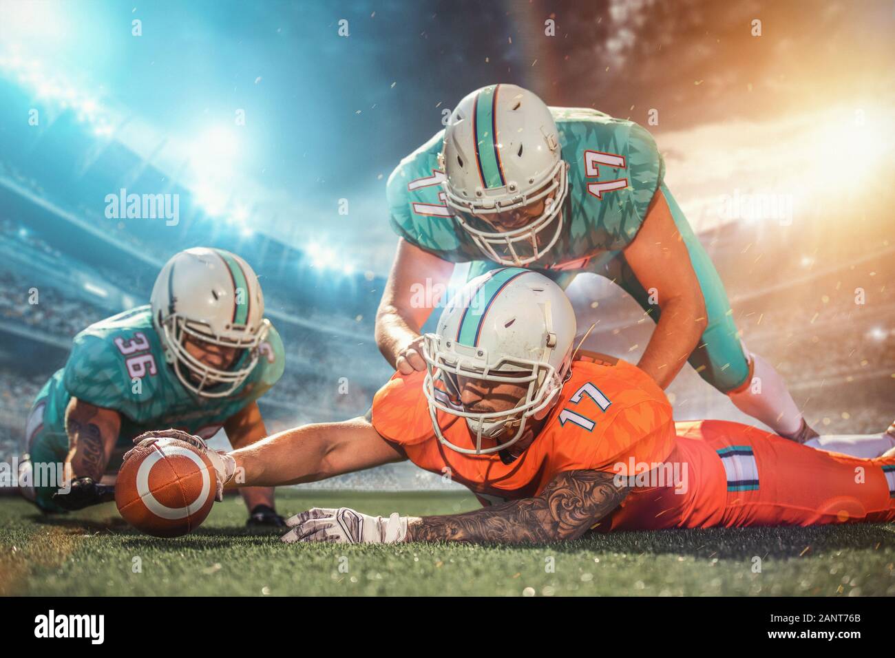 American football player in action on the stadium Stock Photo - Alamy