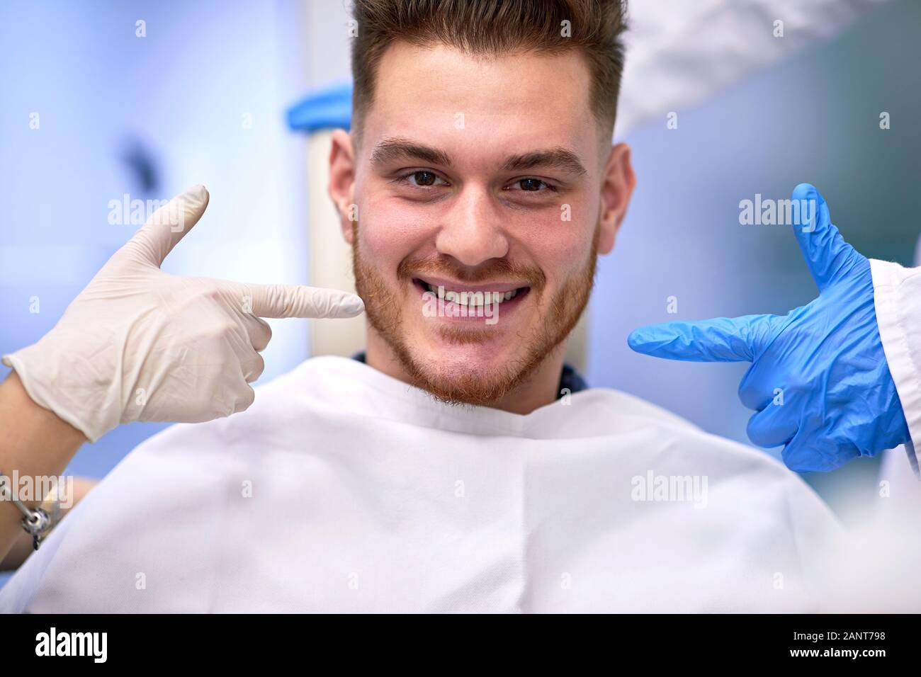 Random dude laughing in dental office after teeth checkup Stock Photo ...