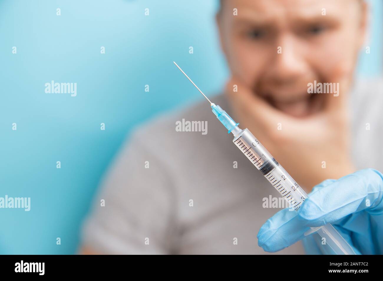 Man is fear and cries from syringe with vaccination doctor appointment ...