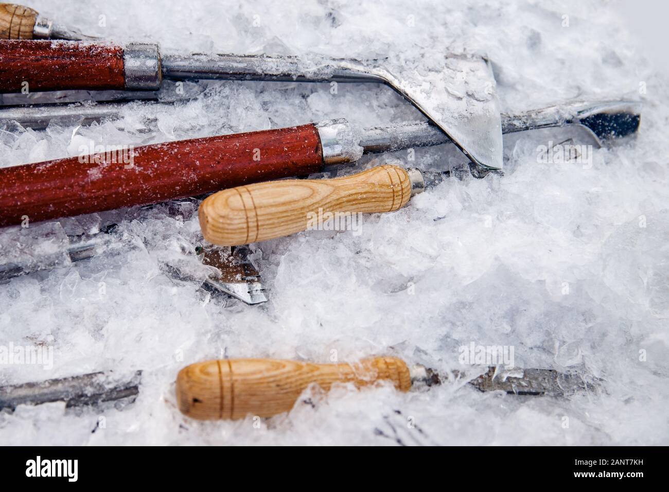 Ice sculpture carving man use chisel cut frozen winter Stock Photo - Alamy