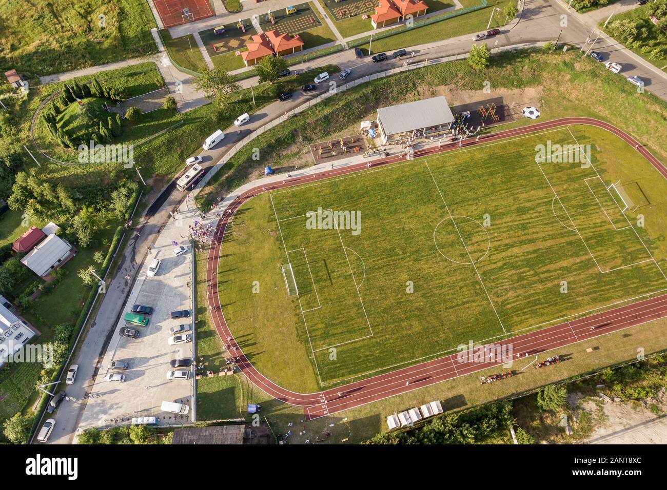 Aerial view of a football field on a stadium covered with green grass ...