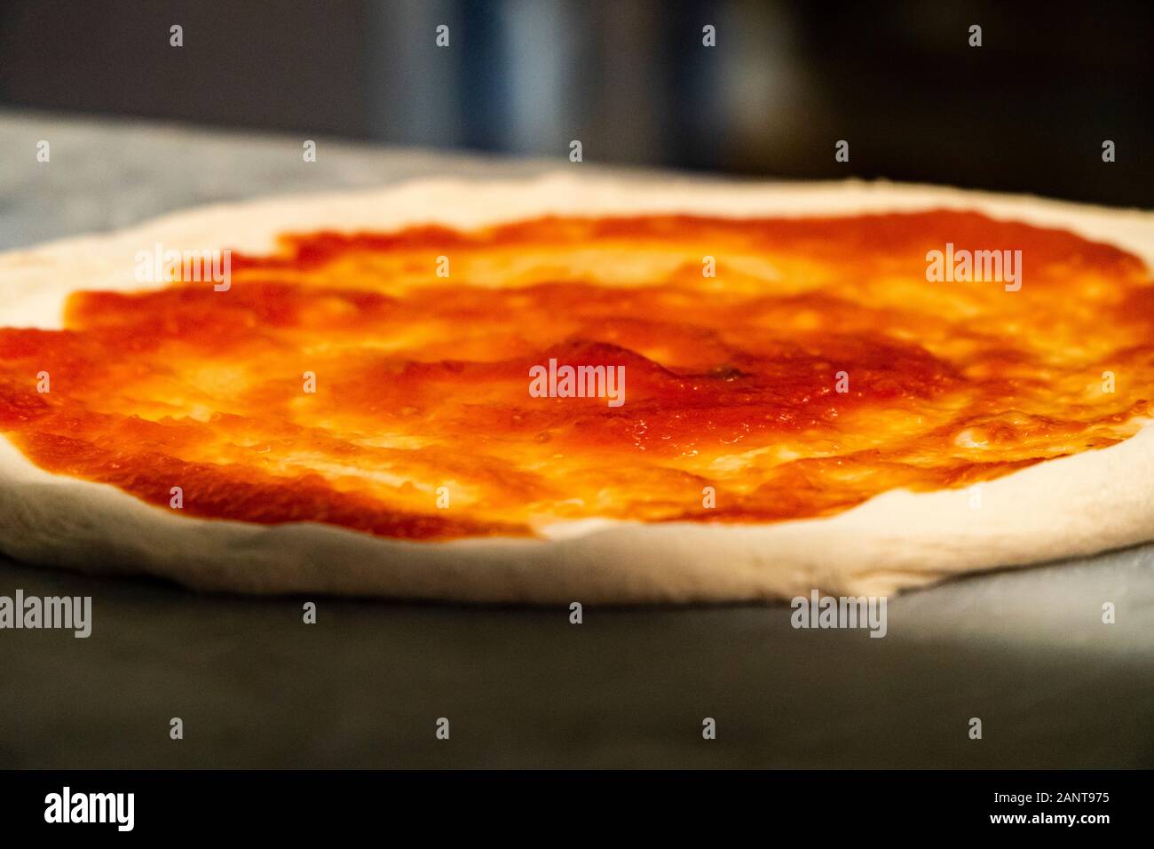 italian tomato pizza ready to cook Stock Photo - Alamy