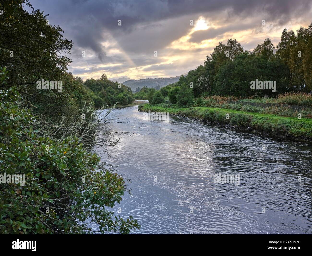 On a a wet, September afternoon, the River Affric flows to the bridge ...