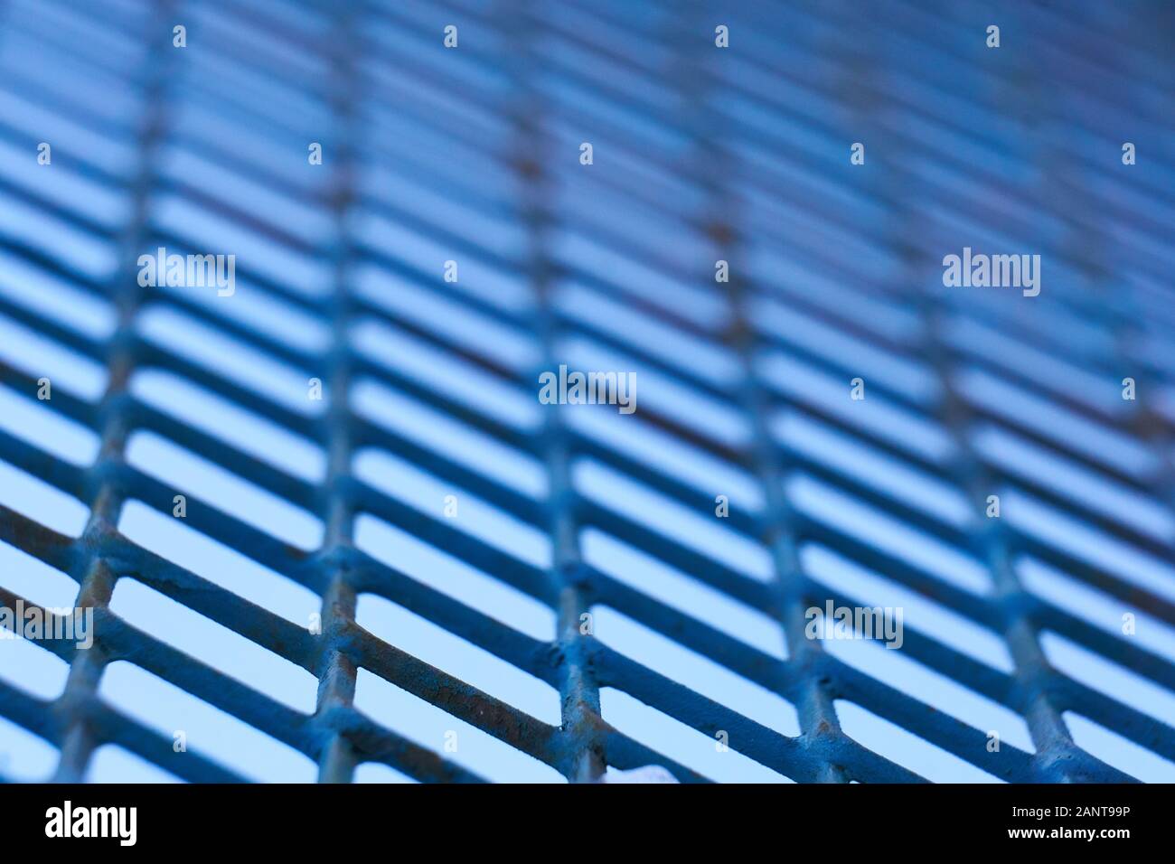 Blue metallic grate pattern with blue back lighting Stock Photo - Alamy