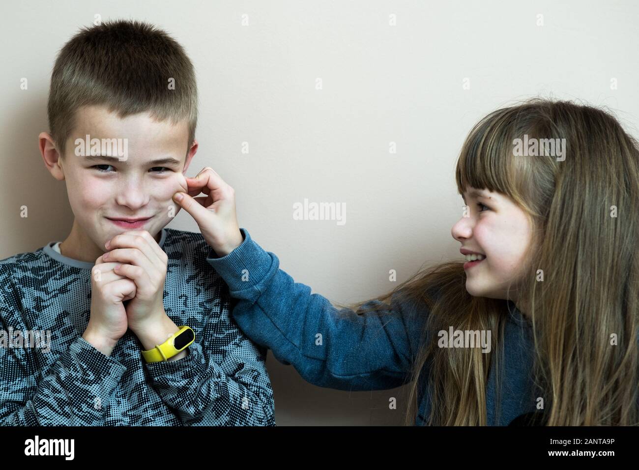 Two children boy and girl fooling around having fun together. Happy ...