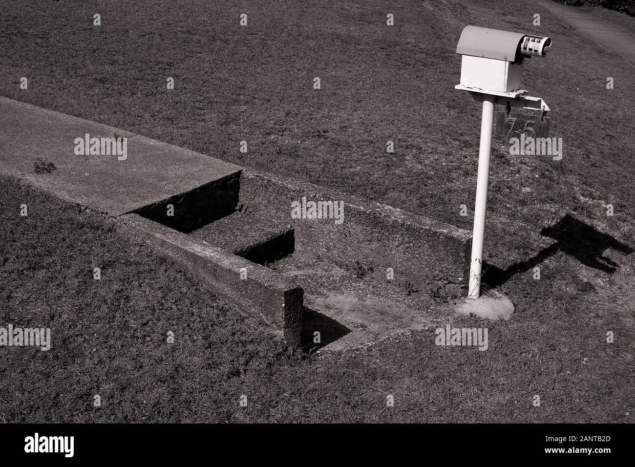 A suburban houses mail box on a steel pole. Architectural survey in the ...