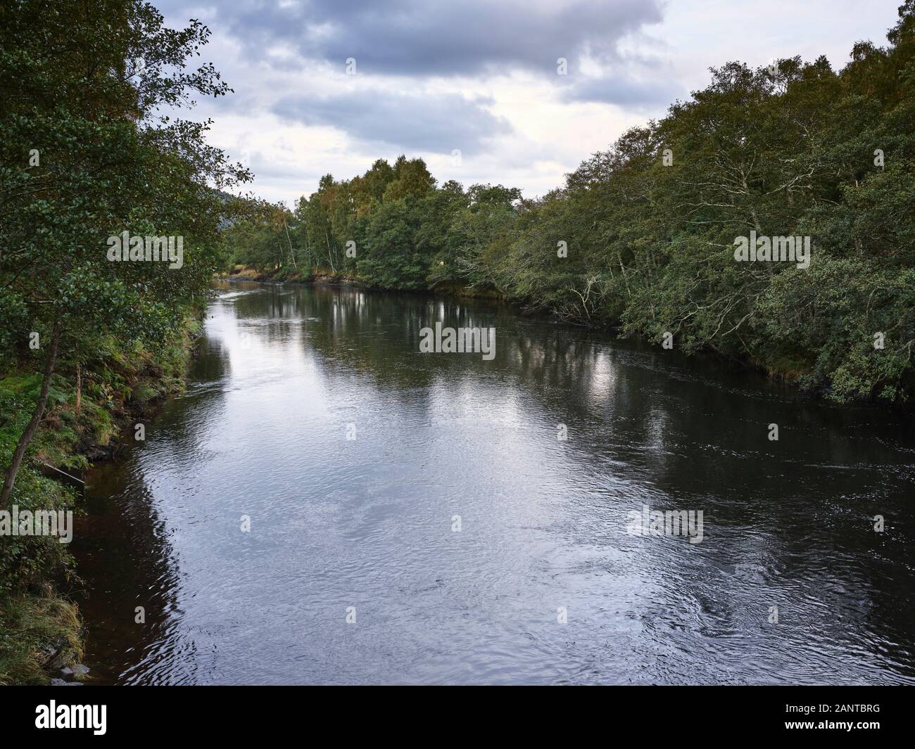 On a a wet, September afternoon, the River Affric flows to the bridge ...