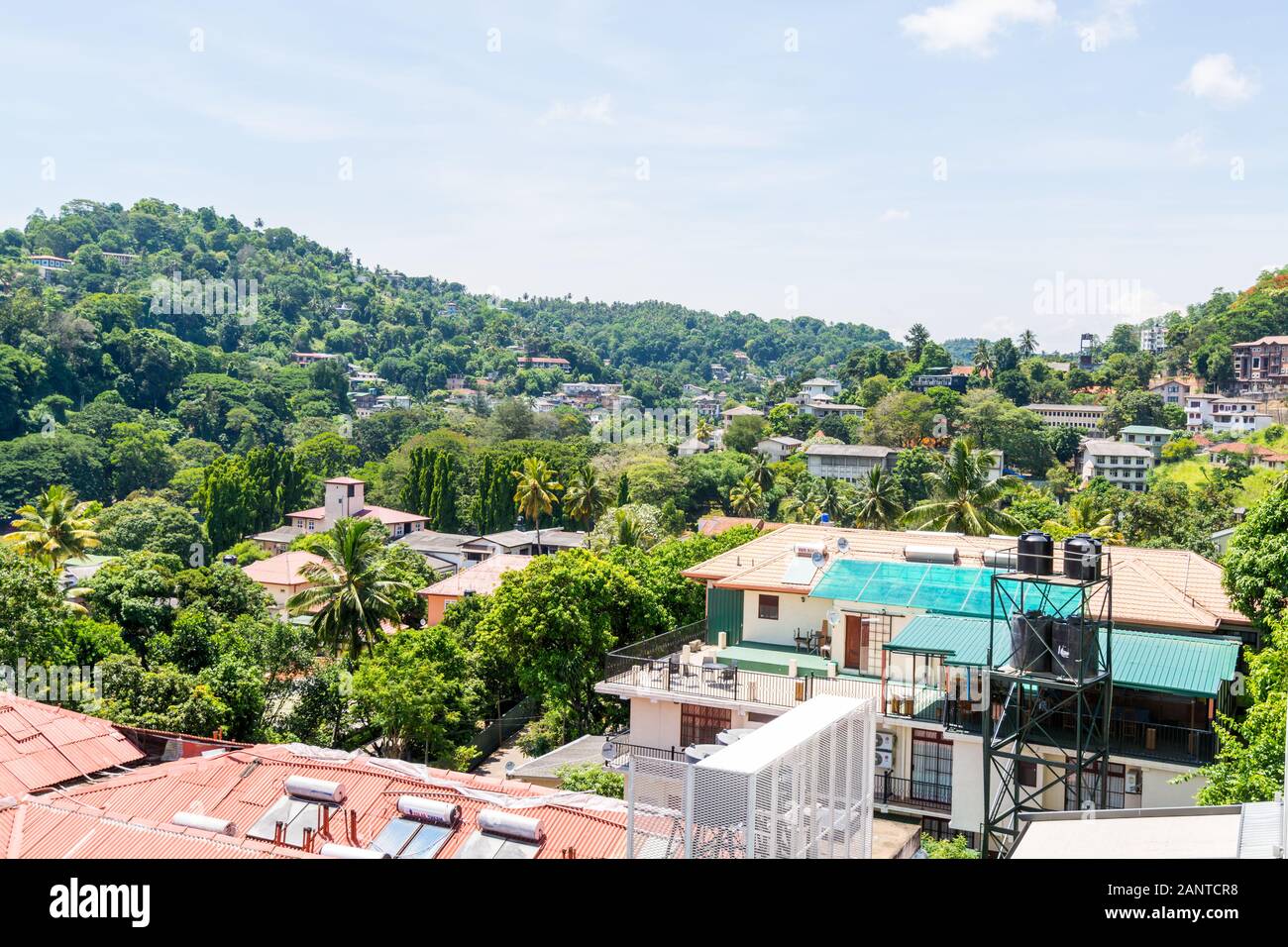 Beautiful builings on the green hills in the downtown, nex to the Kandy ...