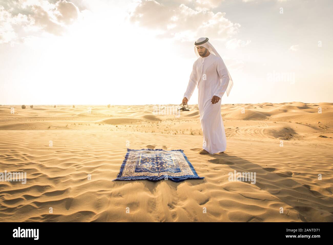 Arabian men witk kandora walking in the desert - Portrait of two middle ...