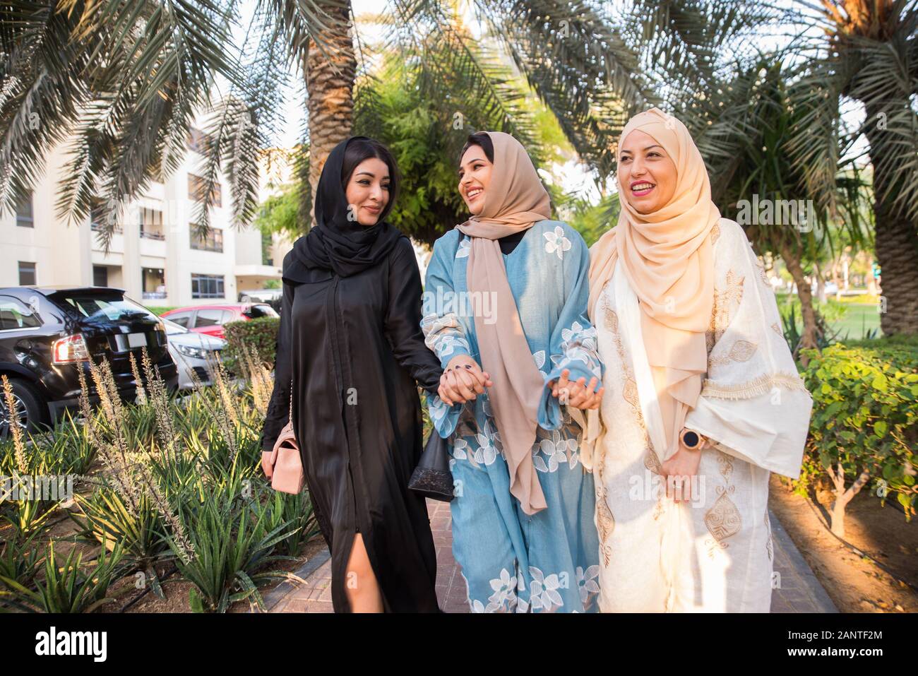 Arabic women with abaya bonding and having fun outdoors - Happy ...