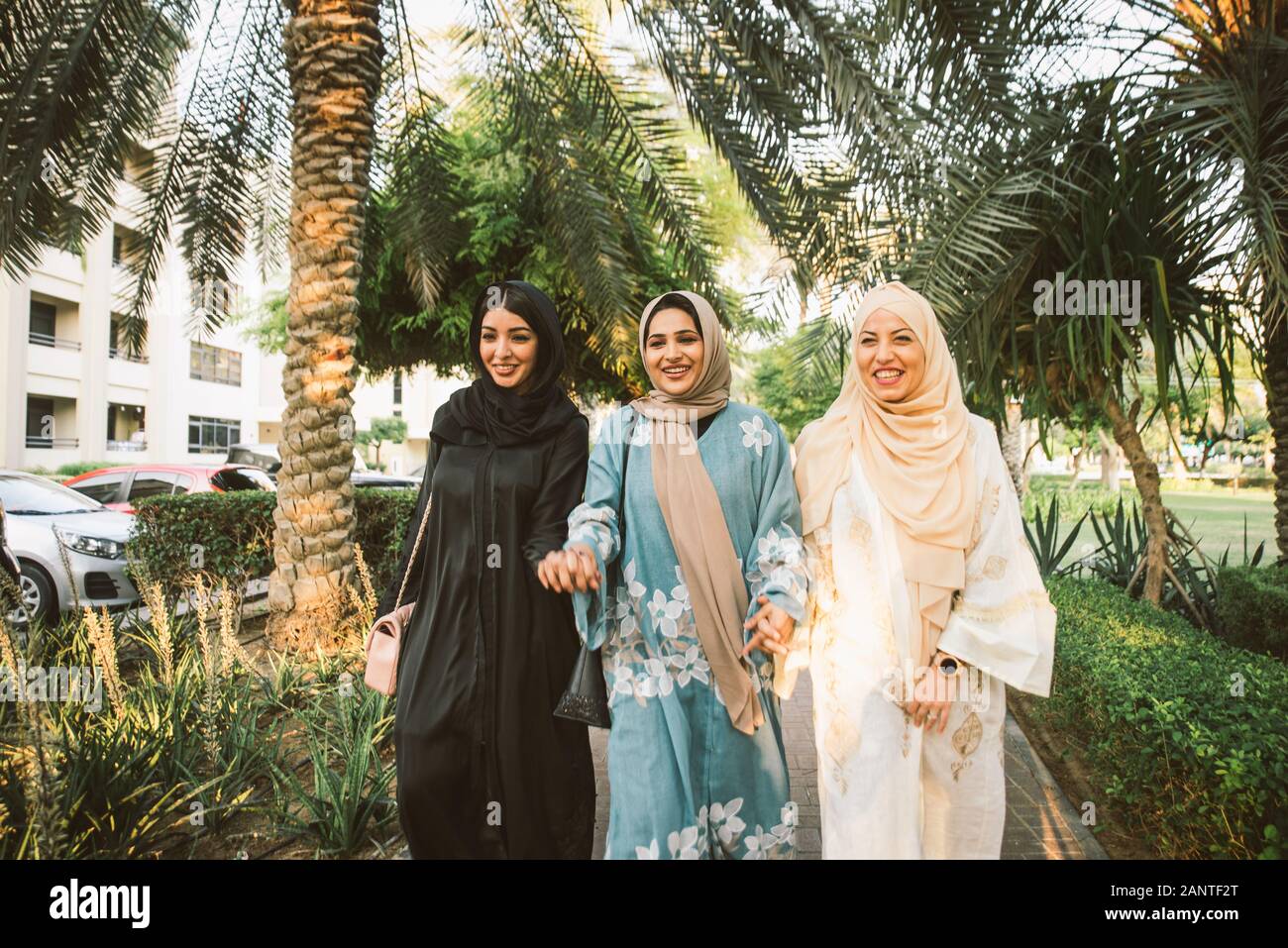 Arabic women with abaya bonding and having fun outdoors - Happy ...