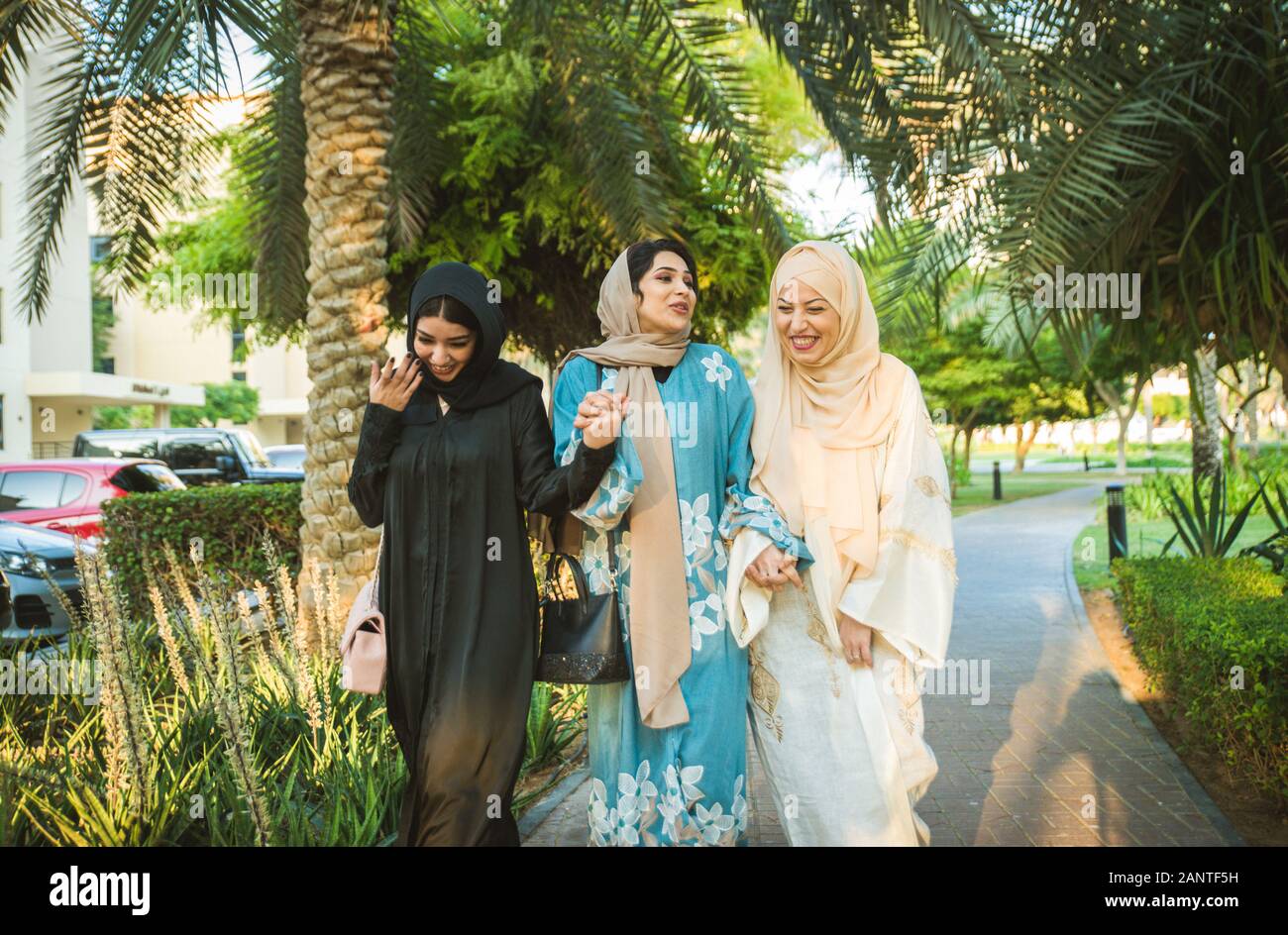 Arabic women with abaya bonding and having fun outdoors - Happy ...